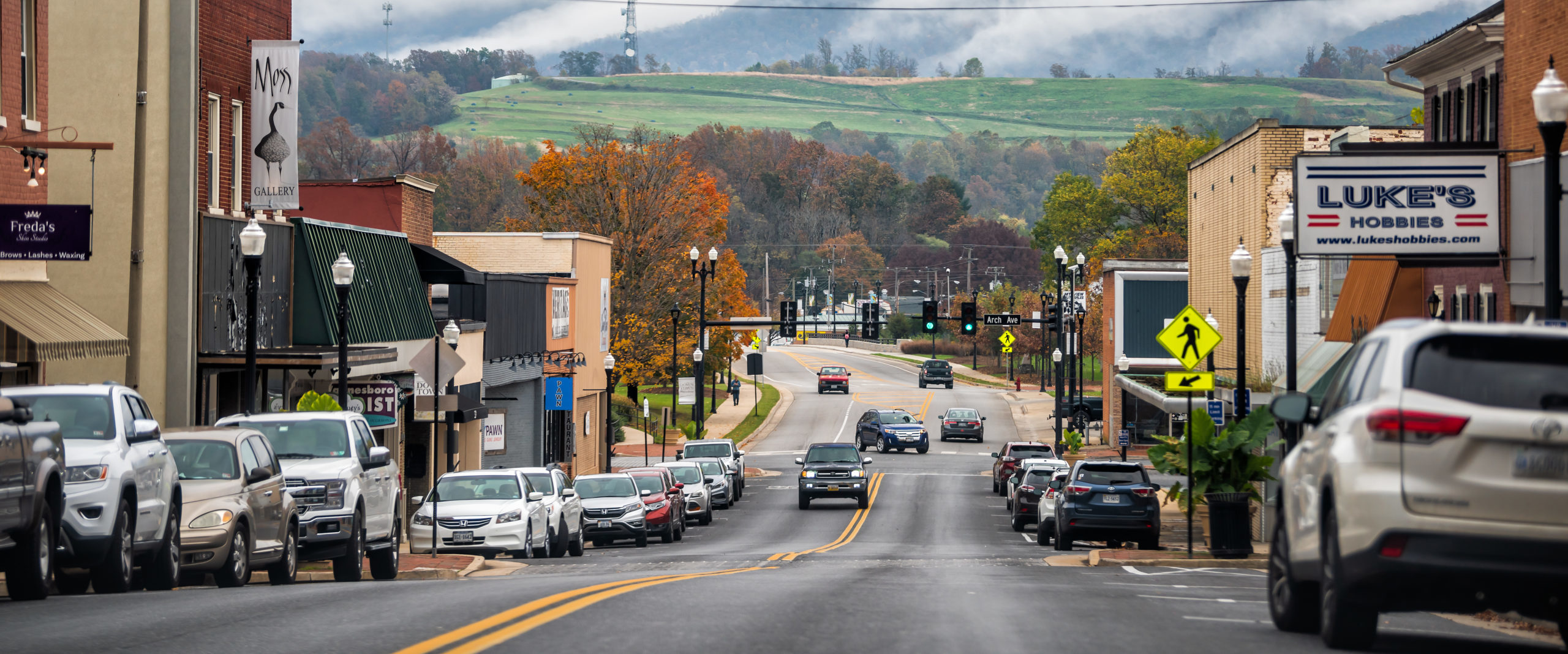 Downtown and mist fog clouds in small town city with Main street in ...